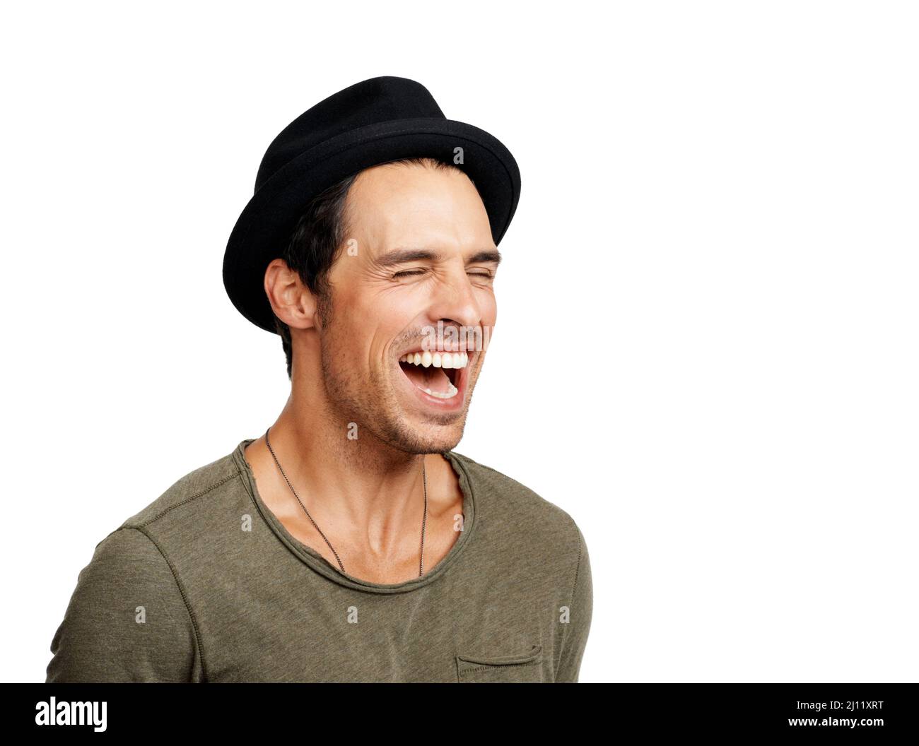 Soooo funny. A handsome young man laughing hysterically Stock Photo - Alamy