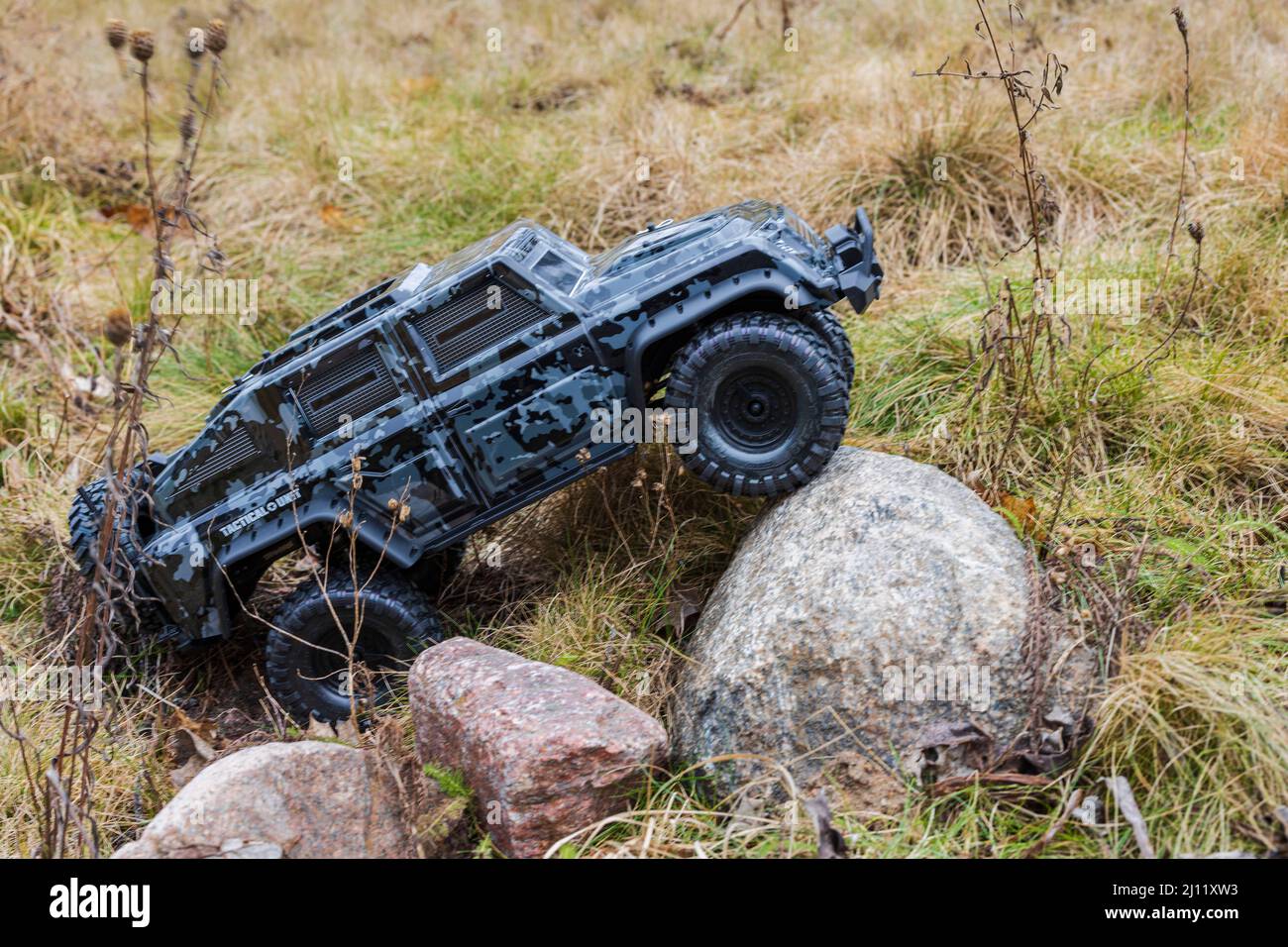 View of radio controlled model racing car military on off-road ...