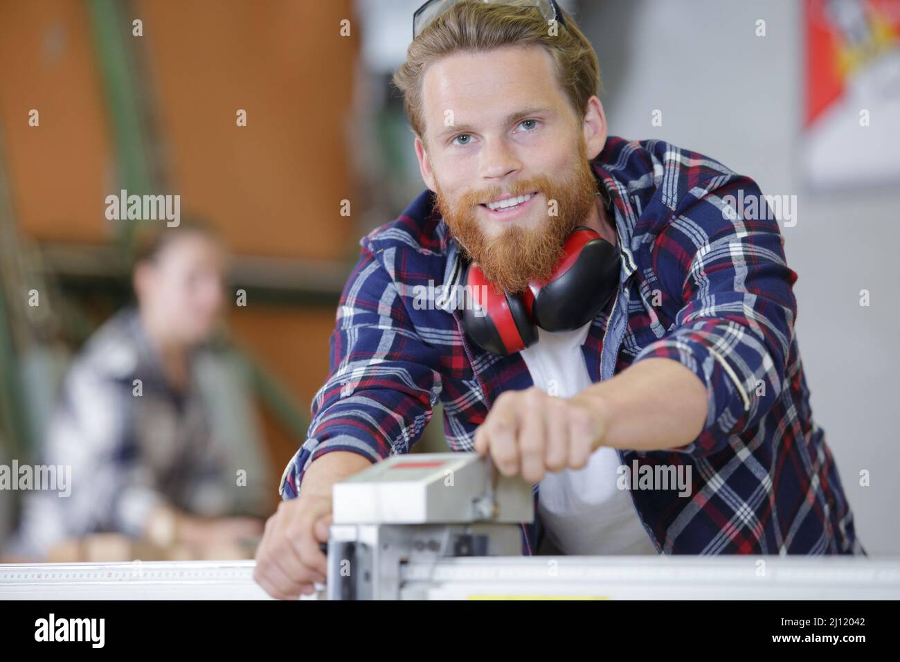 man is cutting wood in a wood factor Stock Photo - Alamy