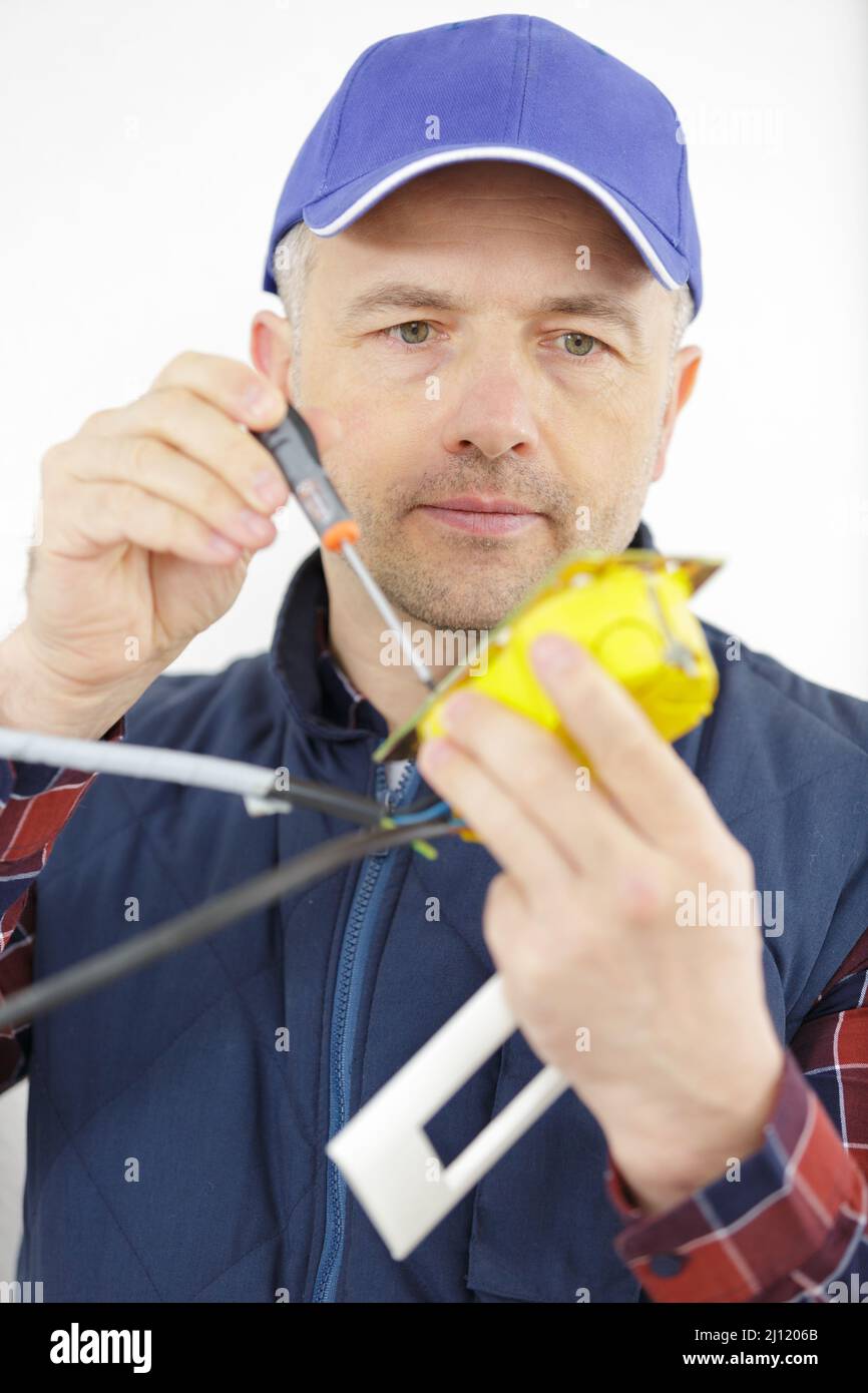 electrical installer working in an electrical box Stock Photo - Alamy