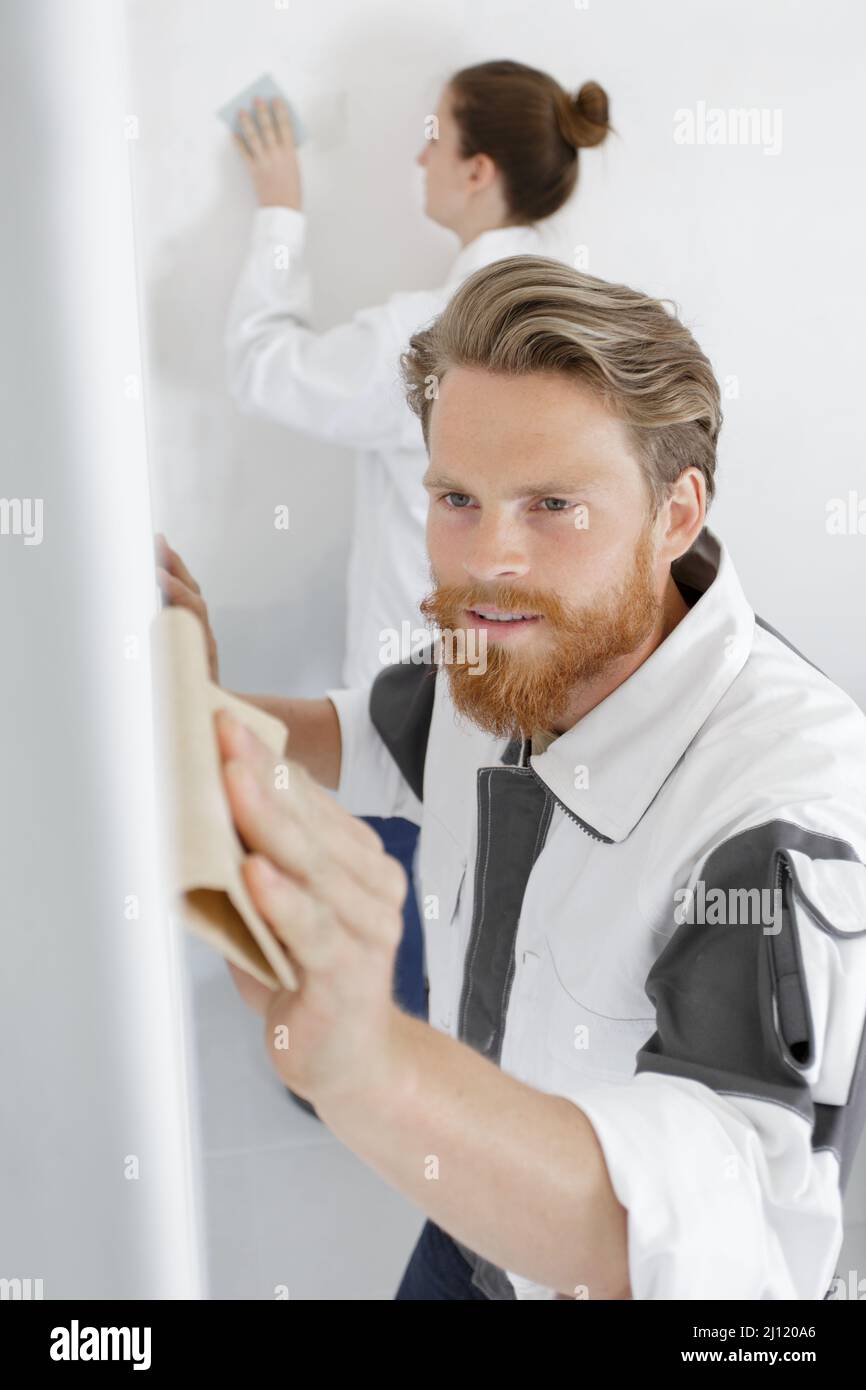 Plastering man hand sanding hi-res stock photography and images - Alamy