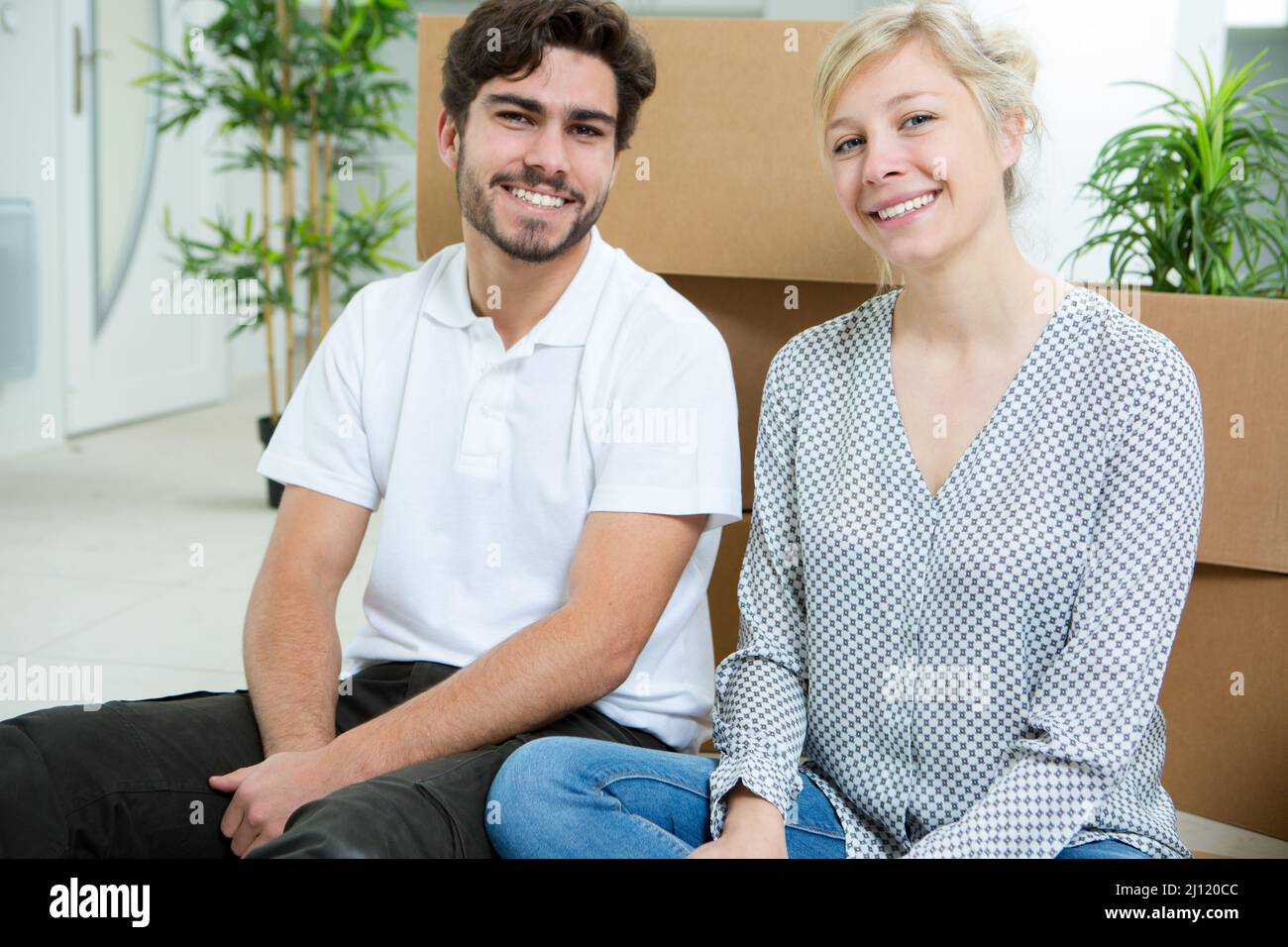a young couple and boxes Stock Photo - Alamy