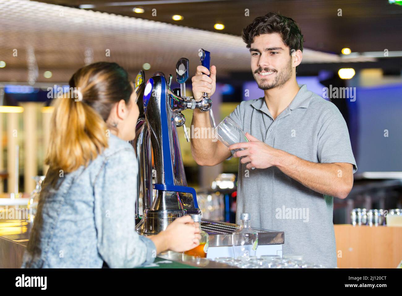 barista serving draught beer Stock Photo - Alamy