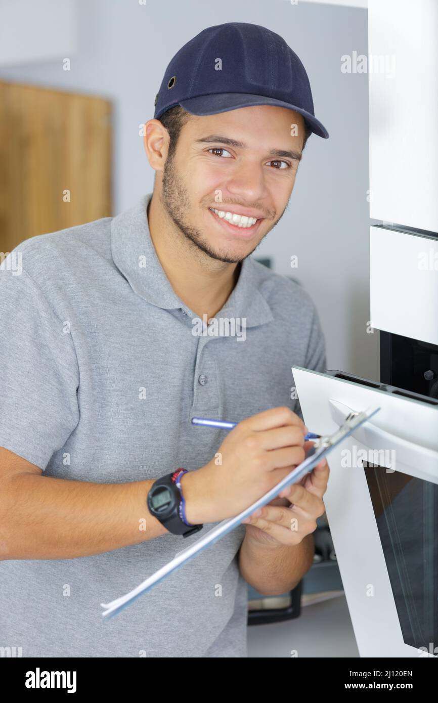 Fixing oven hi-res stock photography and images - Alamy