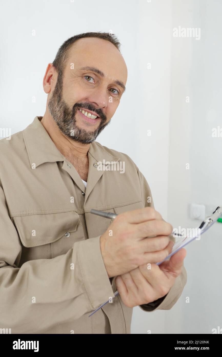 builder happy to have finished the job Stock Photo - Alamy