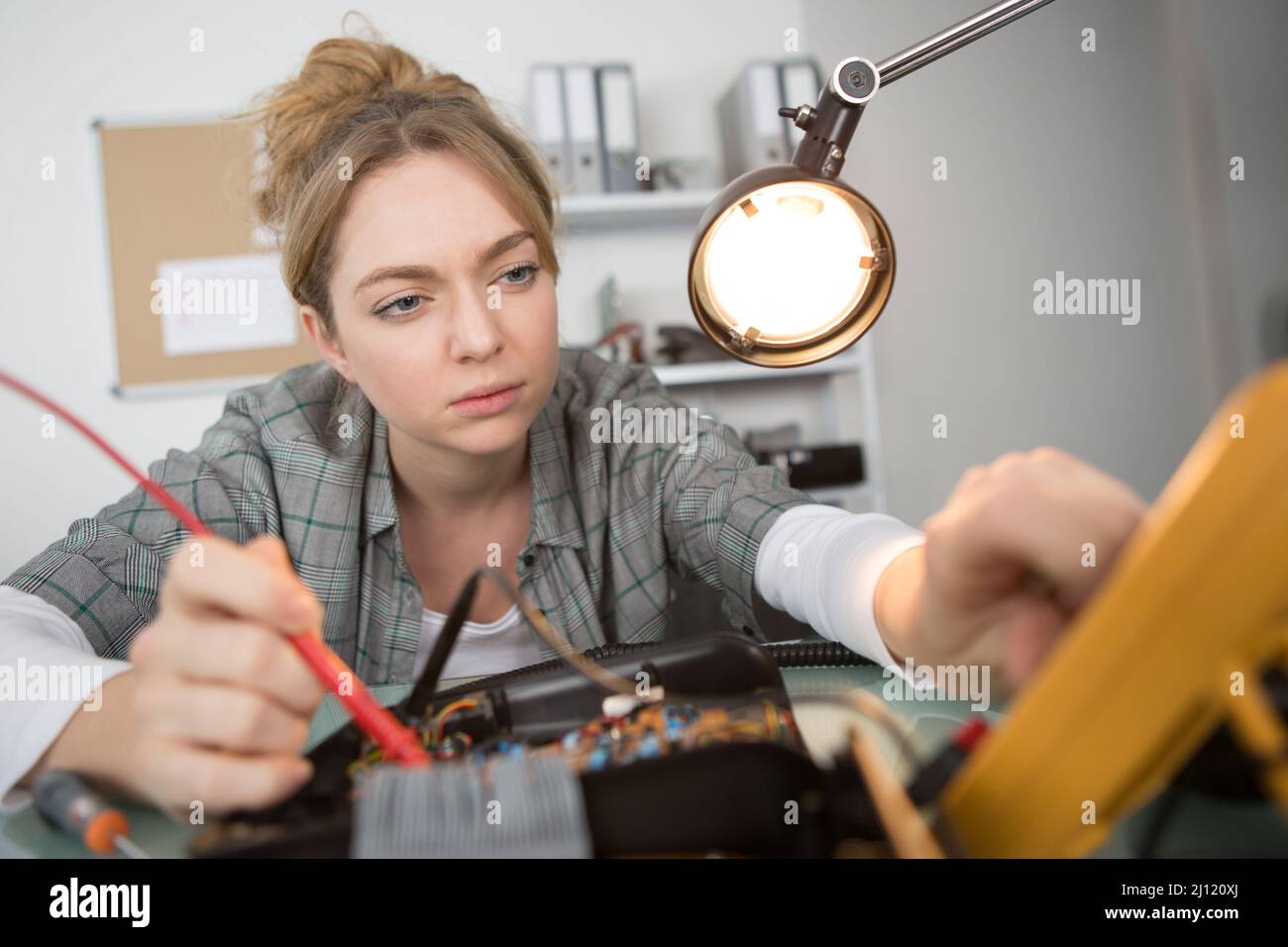 female technician using a multimeter Stock Photo - Alamy