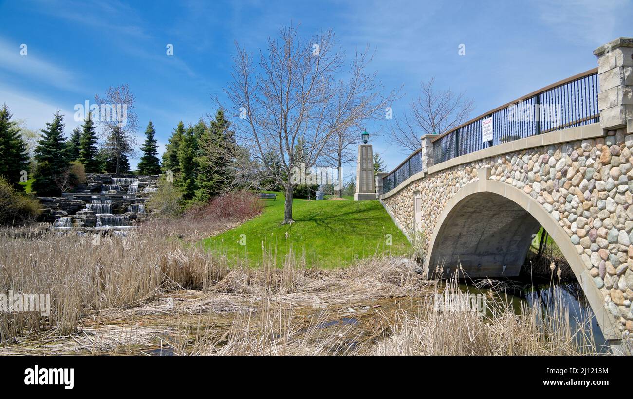 Stone bridge over the stream in a public park Stock Photo - Alamy
