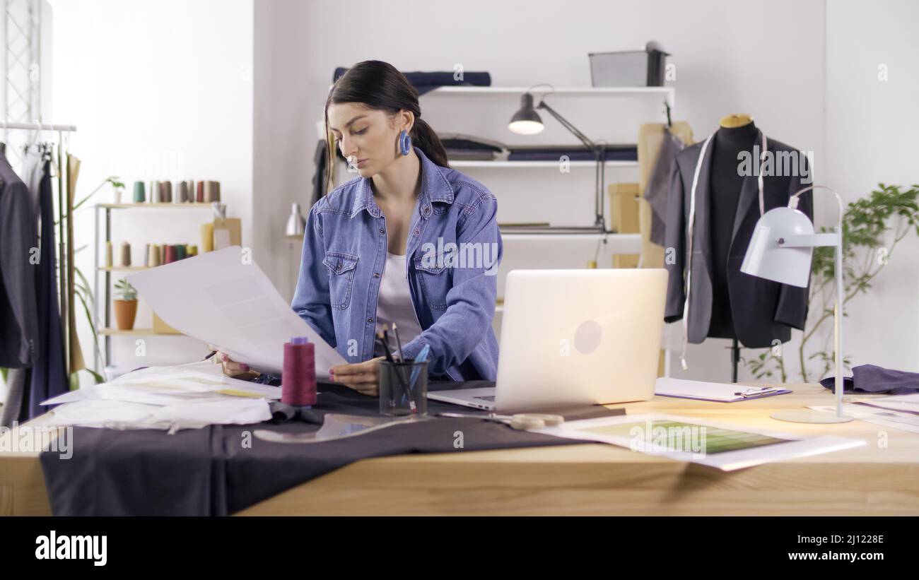 Female clothing designer creates exclusive hi-res stock photography and ...