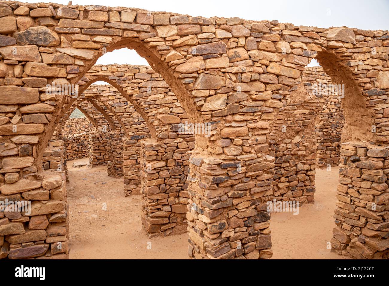 Horseshoe arches of XV century mosque, Ouadane, Mauritania Stock Photo ...