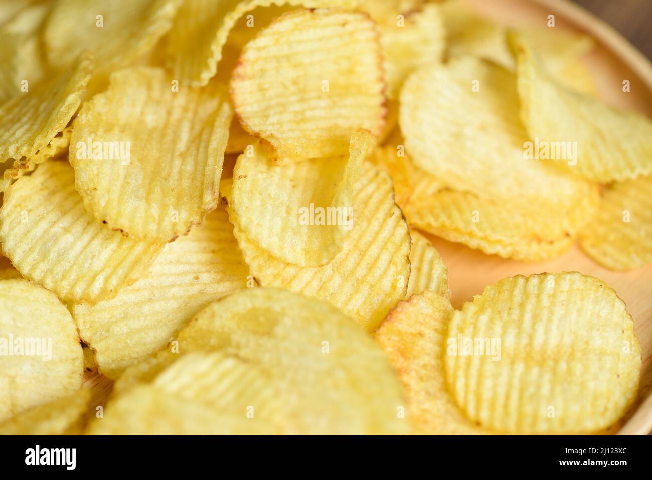 Potato chips texture background, Corrugated crispy potato chips snack ...