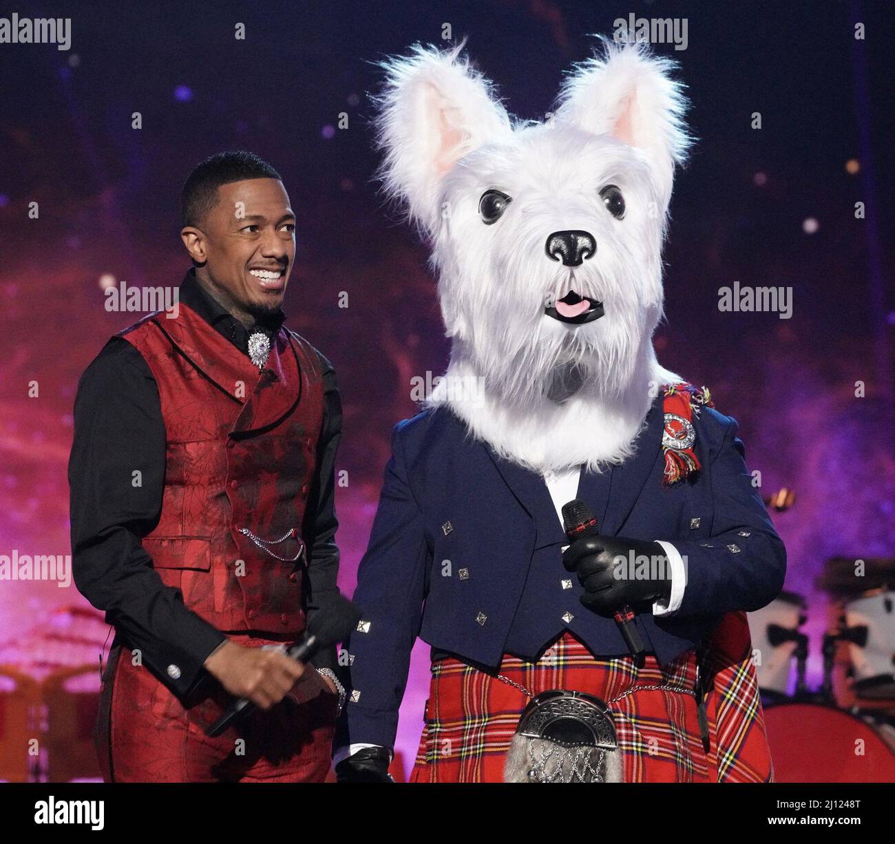 THE MASKED SINGER, from left: host Nick Cannon, McTerrier, 'Masks Back ...
