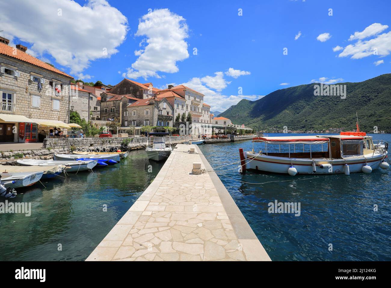 Boats moored in the harbor in Perast town, Montenegro Stock Photo - Alamy