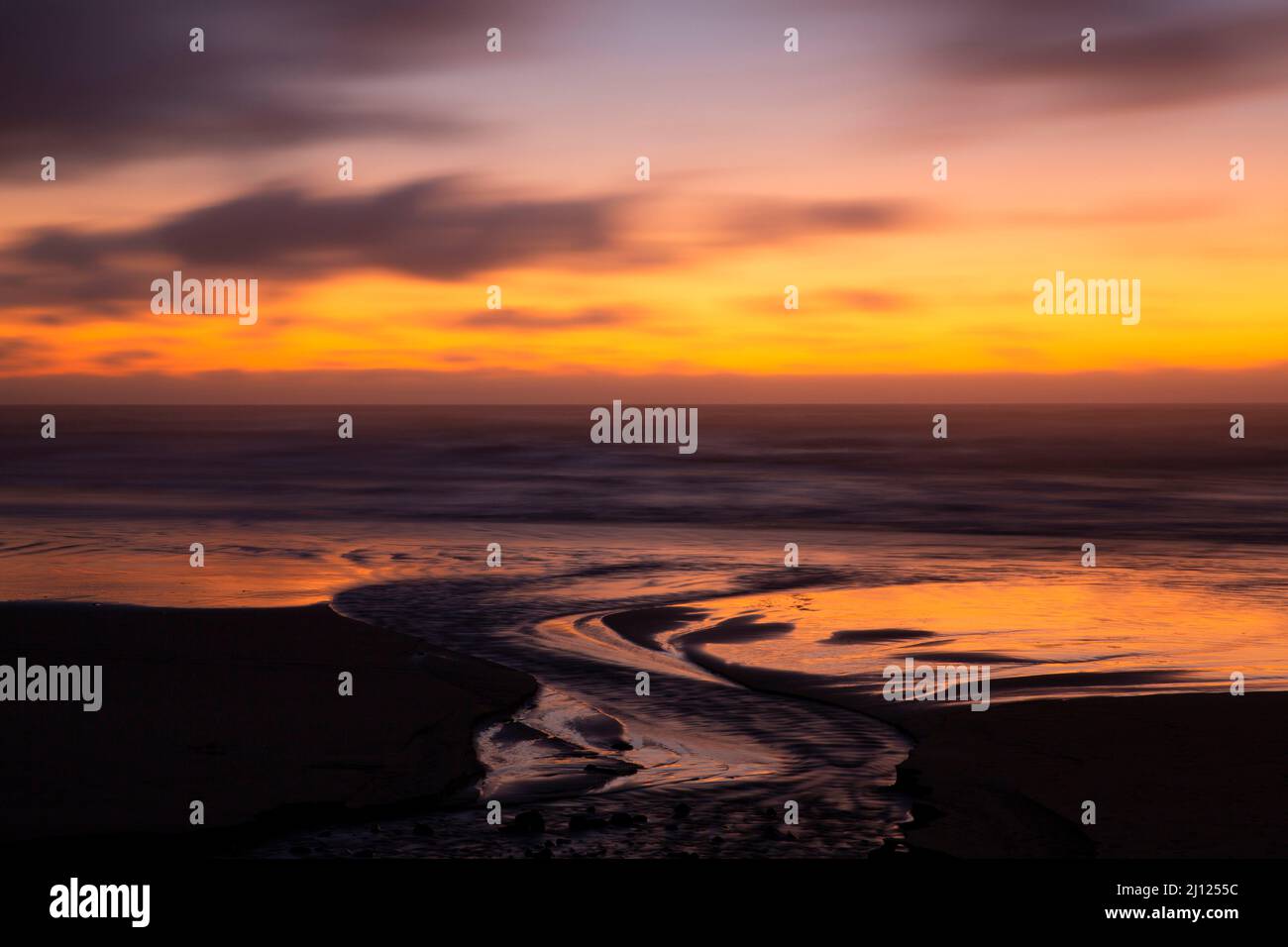 Jackson Creek sunset on beach, Cape Lookout State Park, Oregon Stock ...
