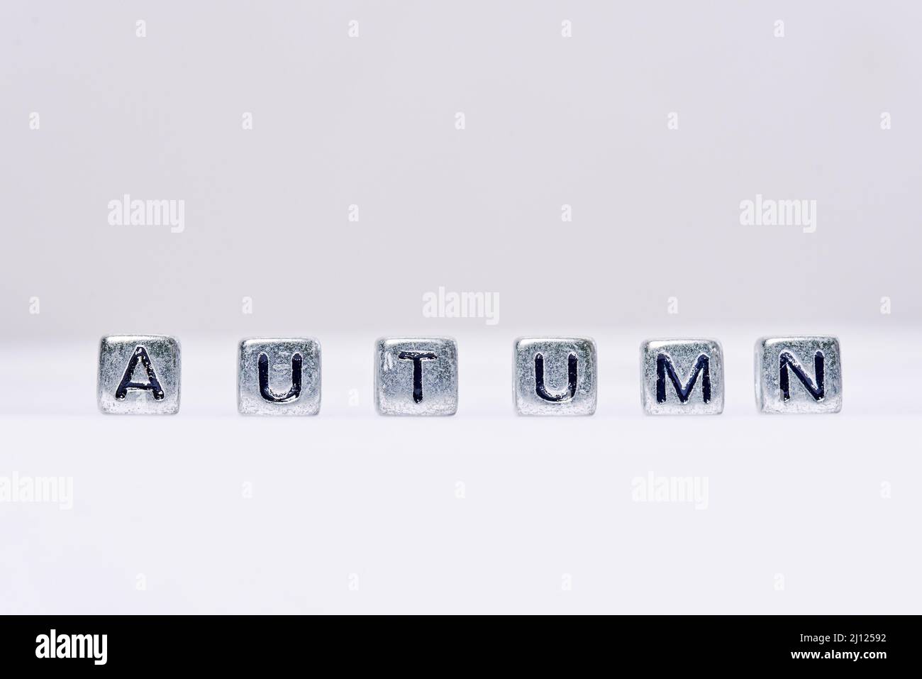 Autumn word on the white background and fall leaf Stock Photo - Alamy