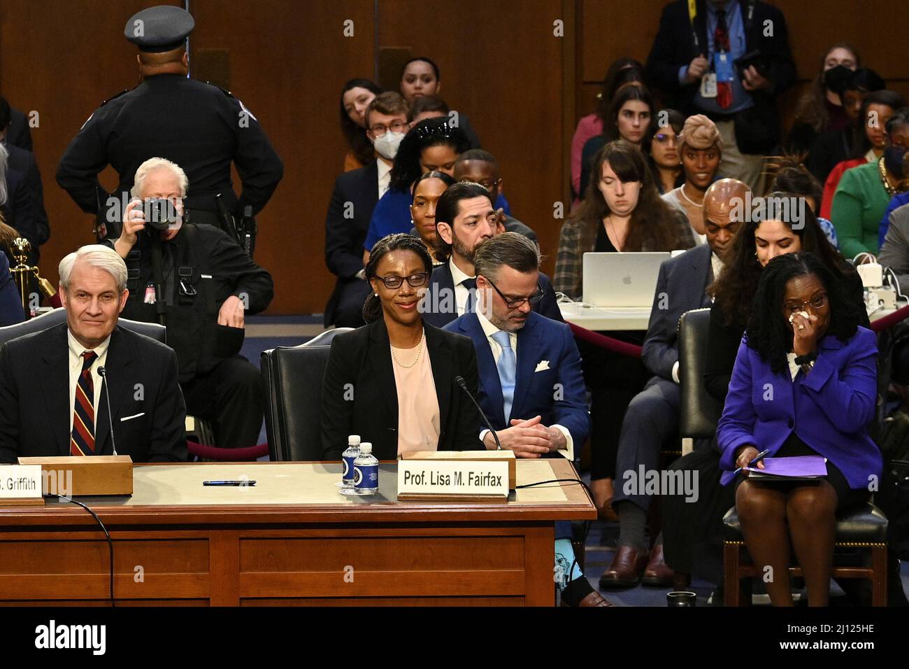 Judge Ketanji Brown Jackson (R) wipes a tear while being introduced by ...