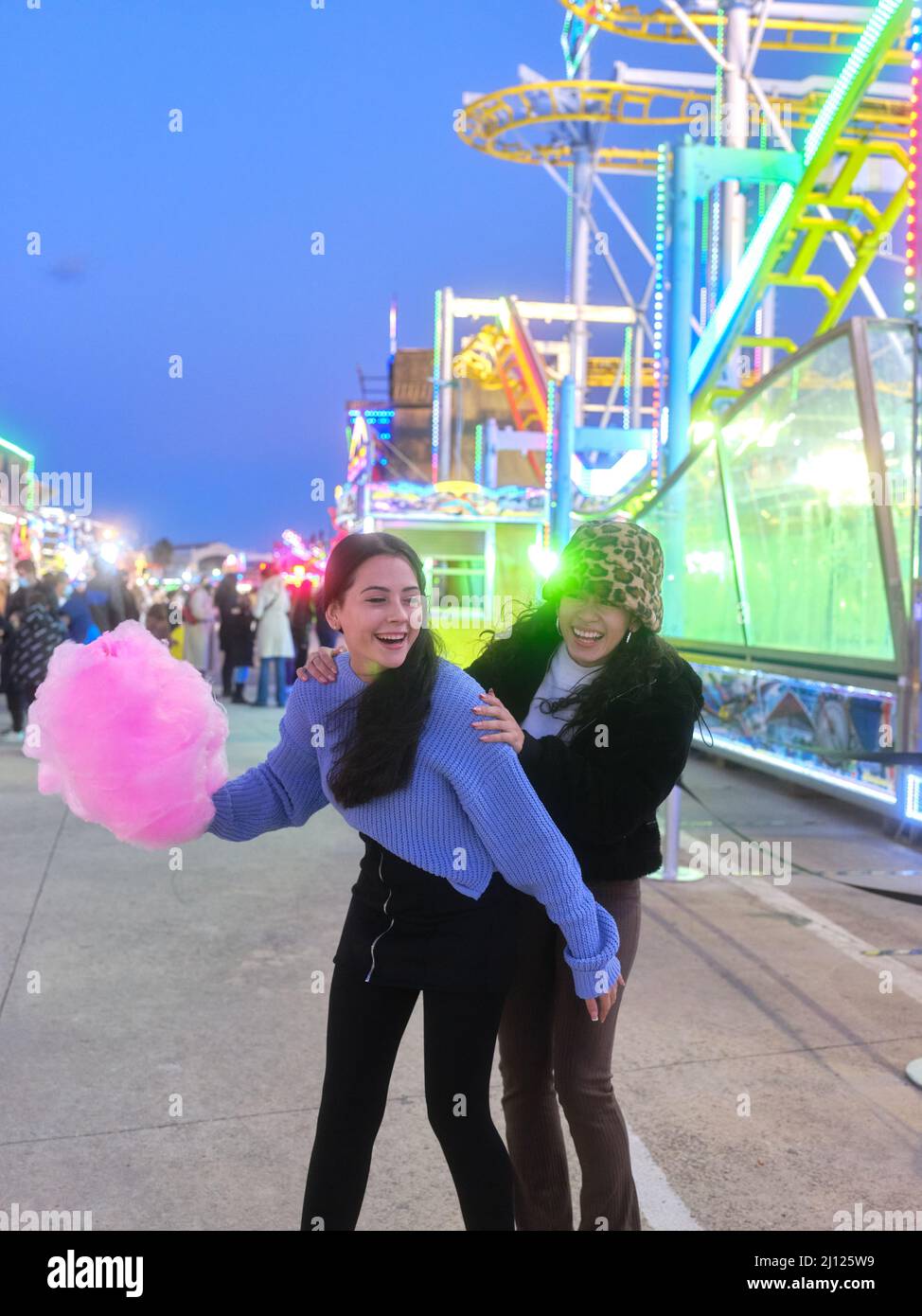 Two friends funfair holding hi-res stock photography and images - Alamy