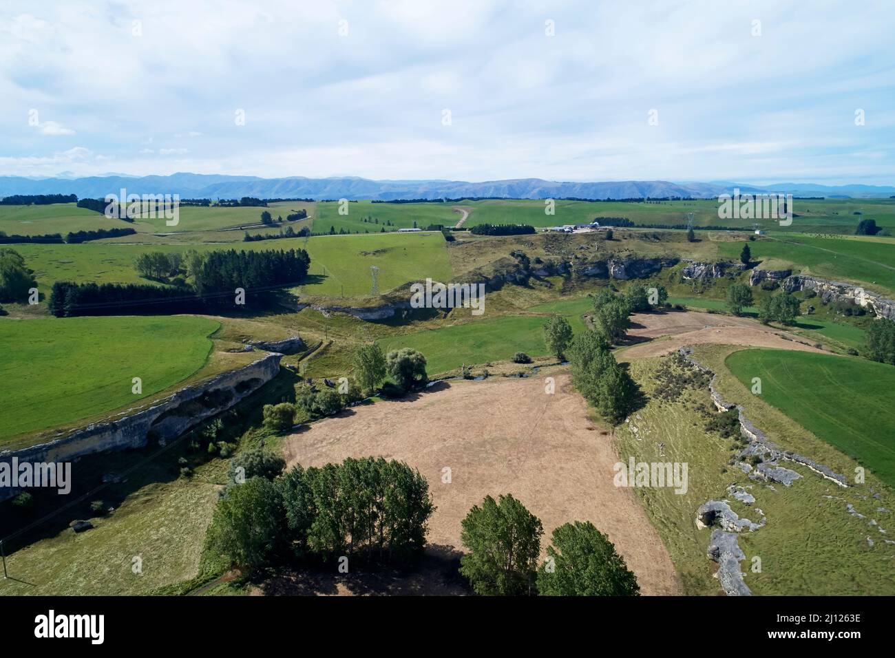 Limestone cliffs and farmland, Island Cliff, North Otago, South Island ...