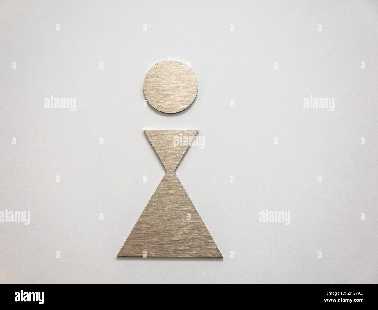 Modern abstract Lady symbol on toilet door Stock Photo - Alamy