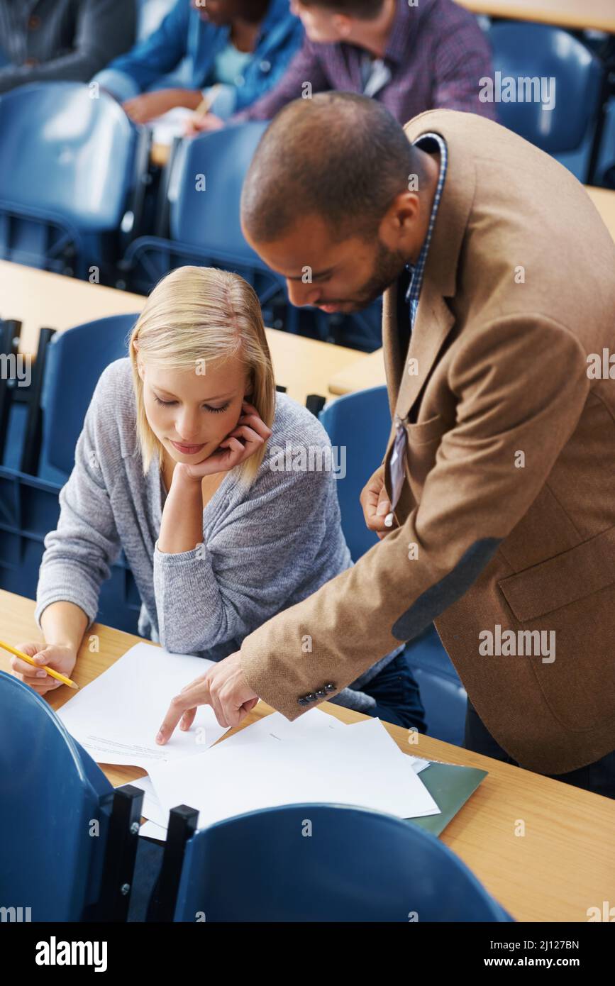 Clarifying the question. Shot of a college teacher pointing something ...