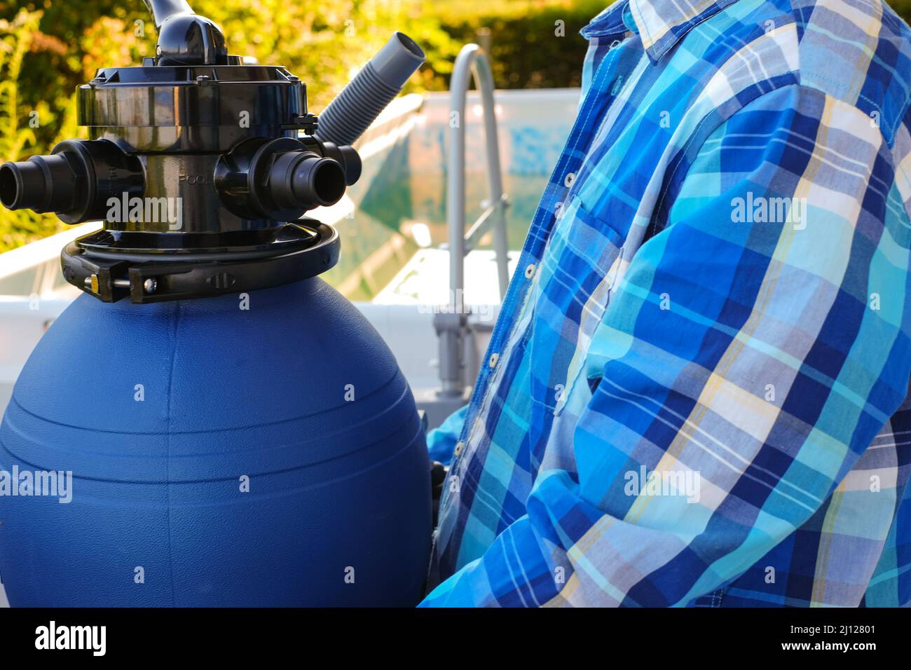Swimming pool Filter.Swimming pool cleaning equipment. Blue water ...
