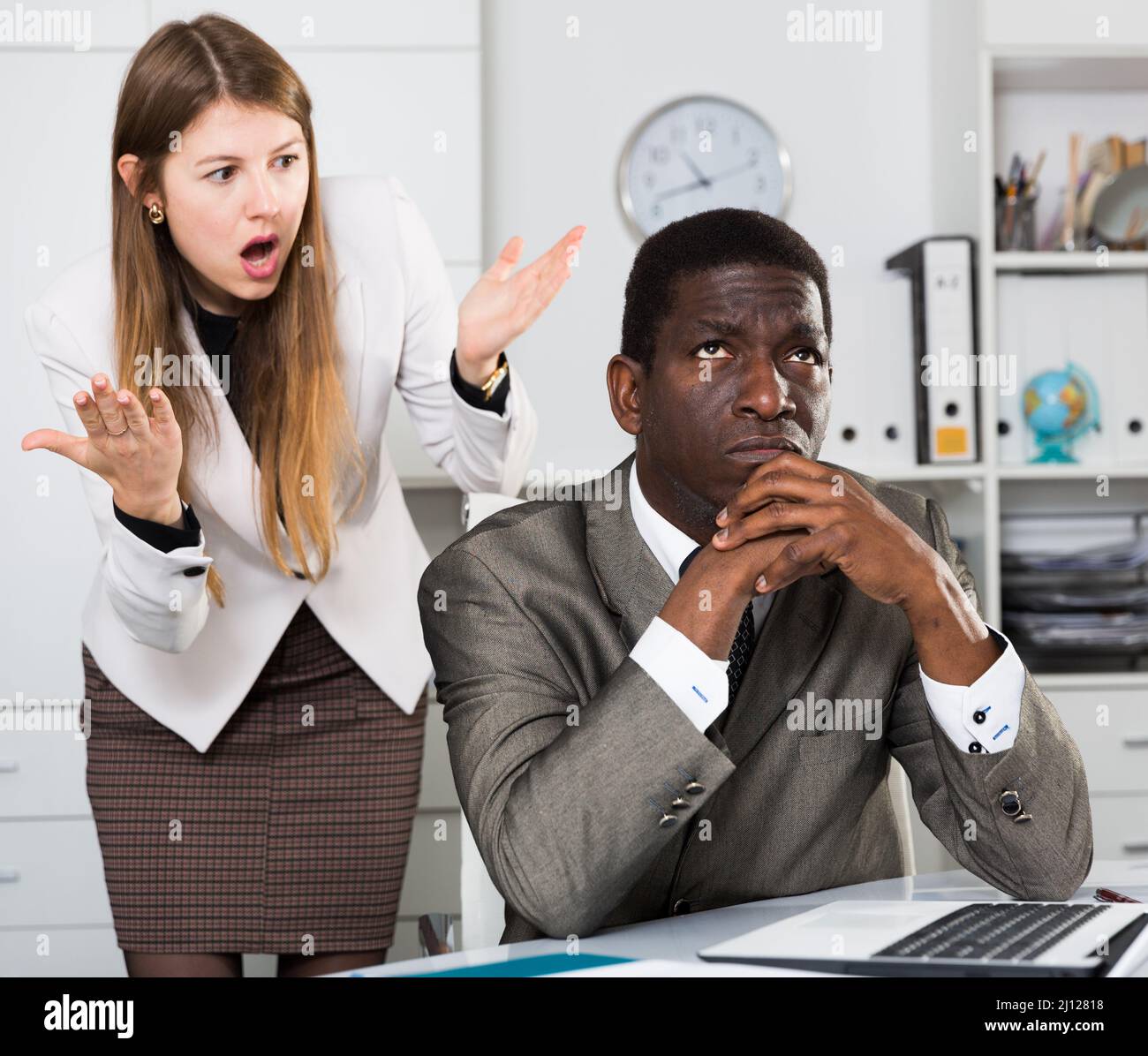 Upset man with angry boss Stock Photo - Alamy