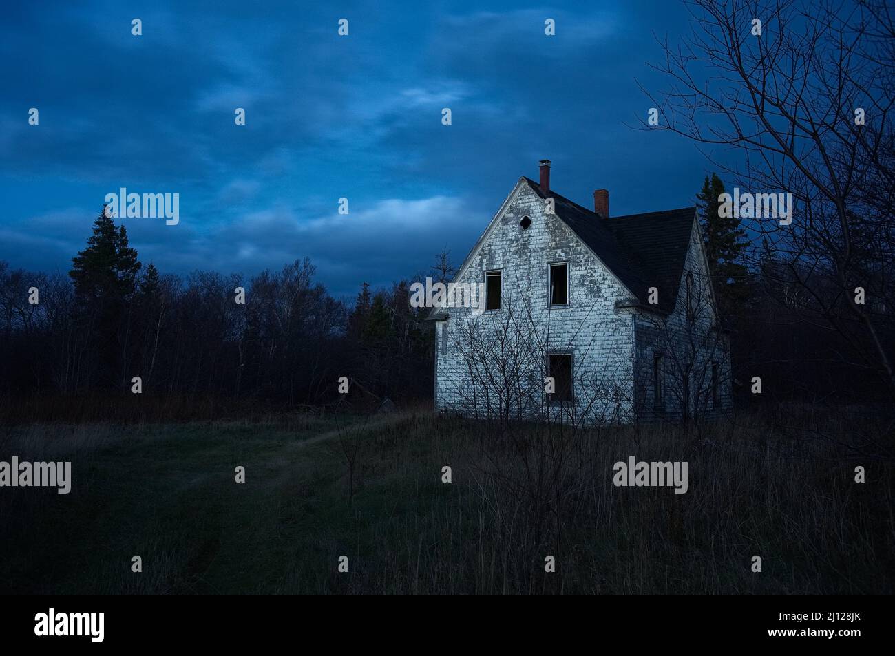 A spooky abandoned house with ominous clouds Stock Photo - Alamy