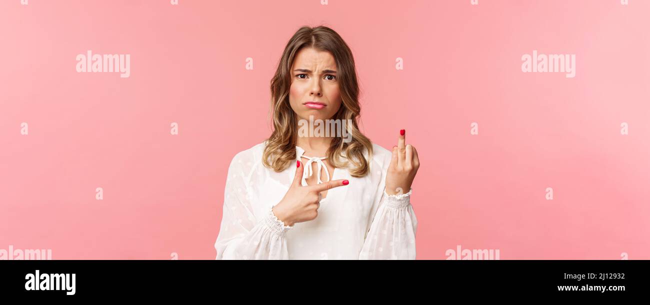 Close-up portrait sad and frustrated young blond girl waited for ...