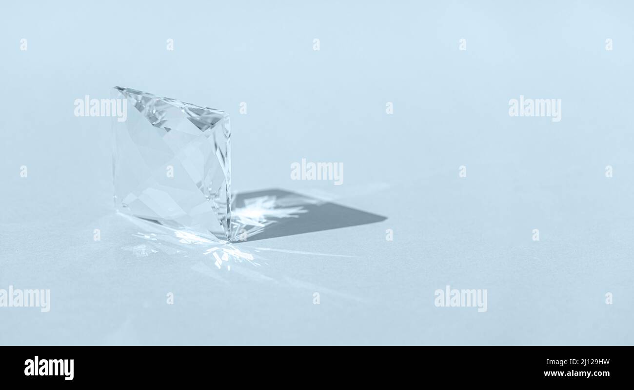 Crystal prism with light diffraction of spectrum colours and reflection ...