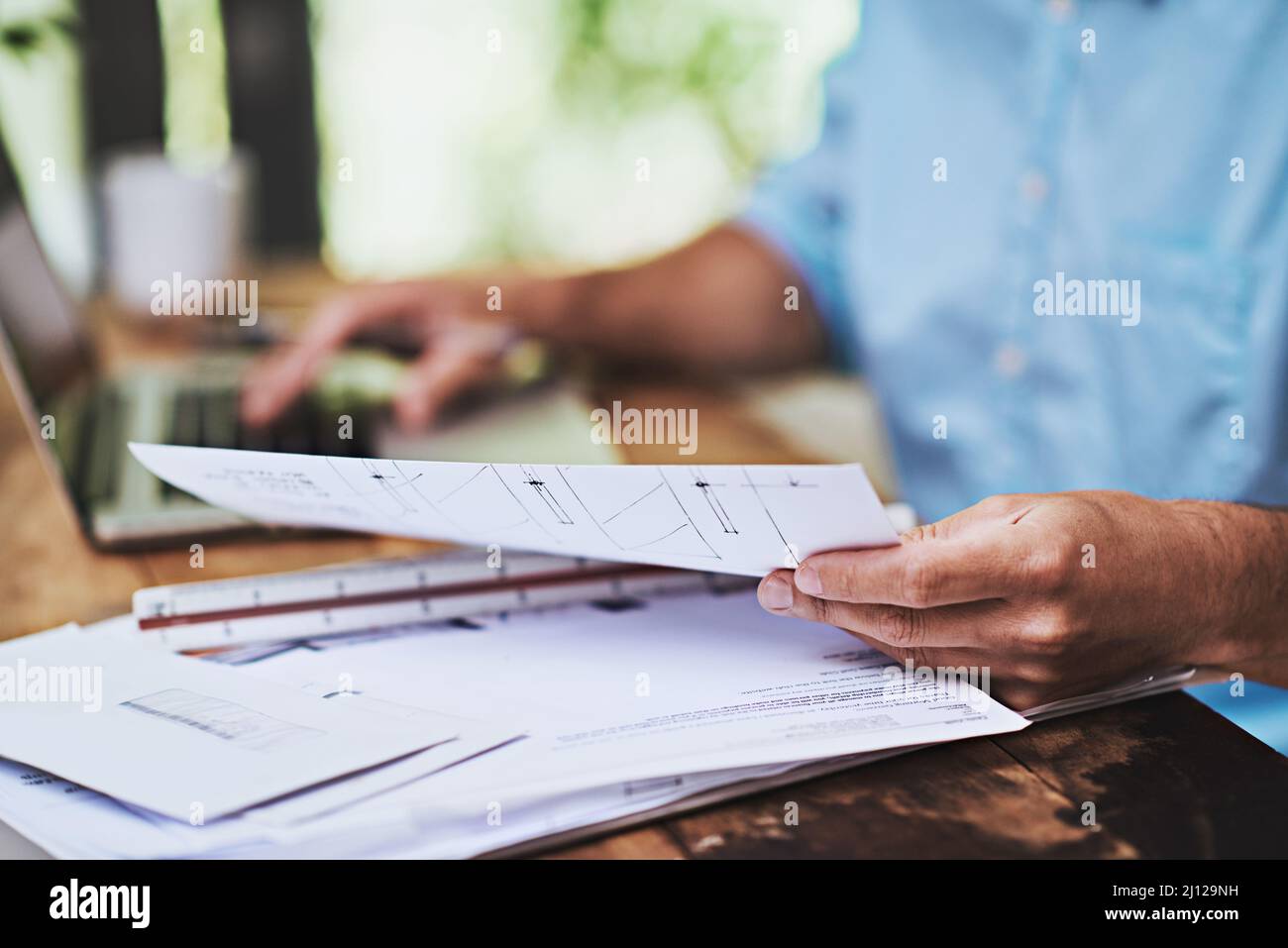 Taking a look at the paperwork. Cropped shot of a businessman reading ...