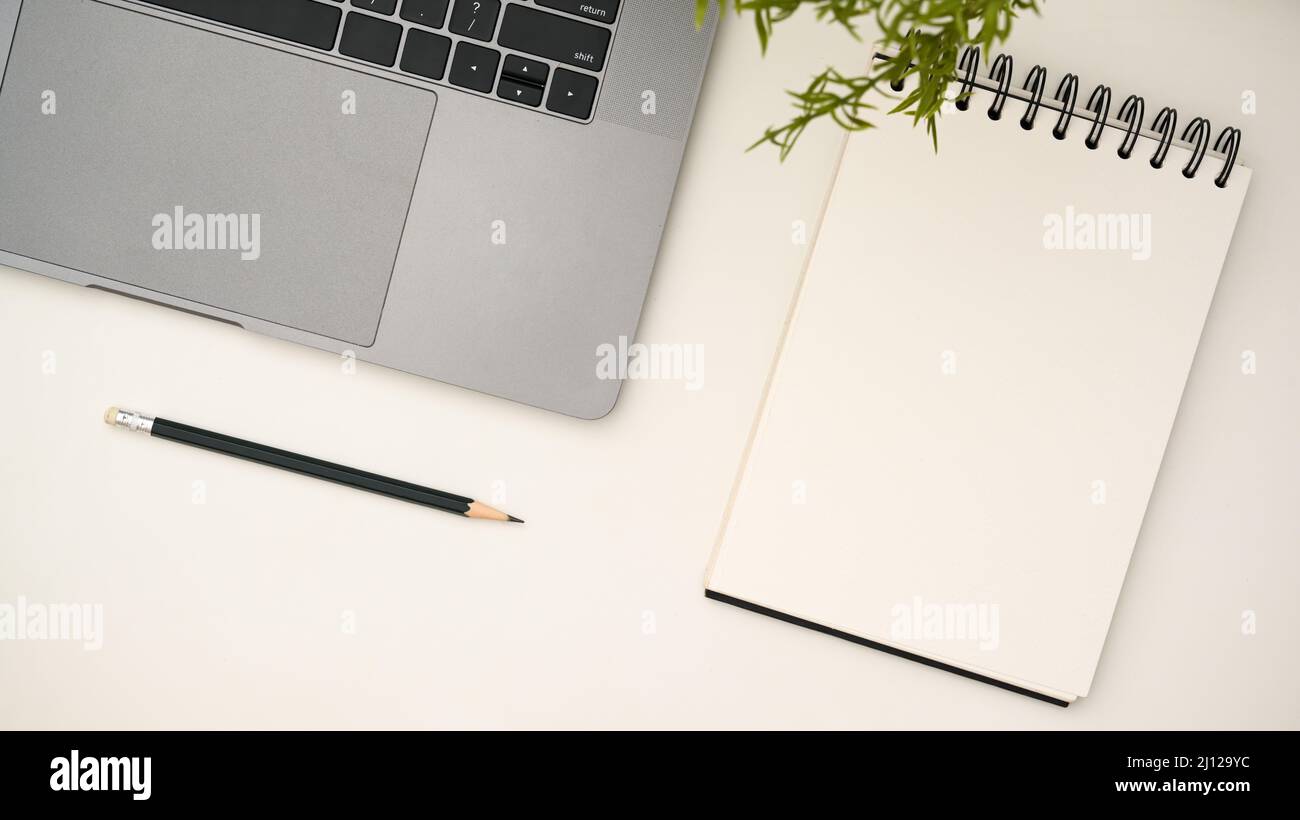 Overhead short, Modern white office desk with laptop computer, pencil ...