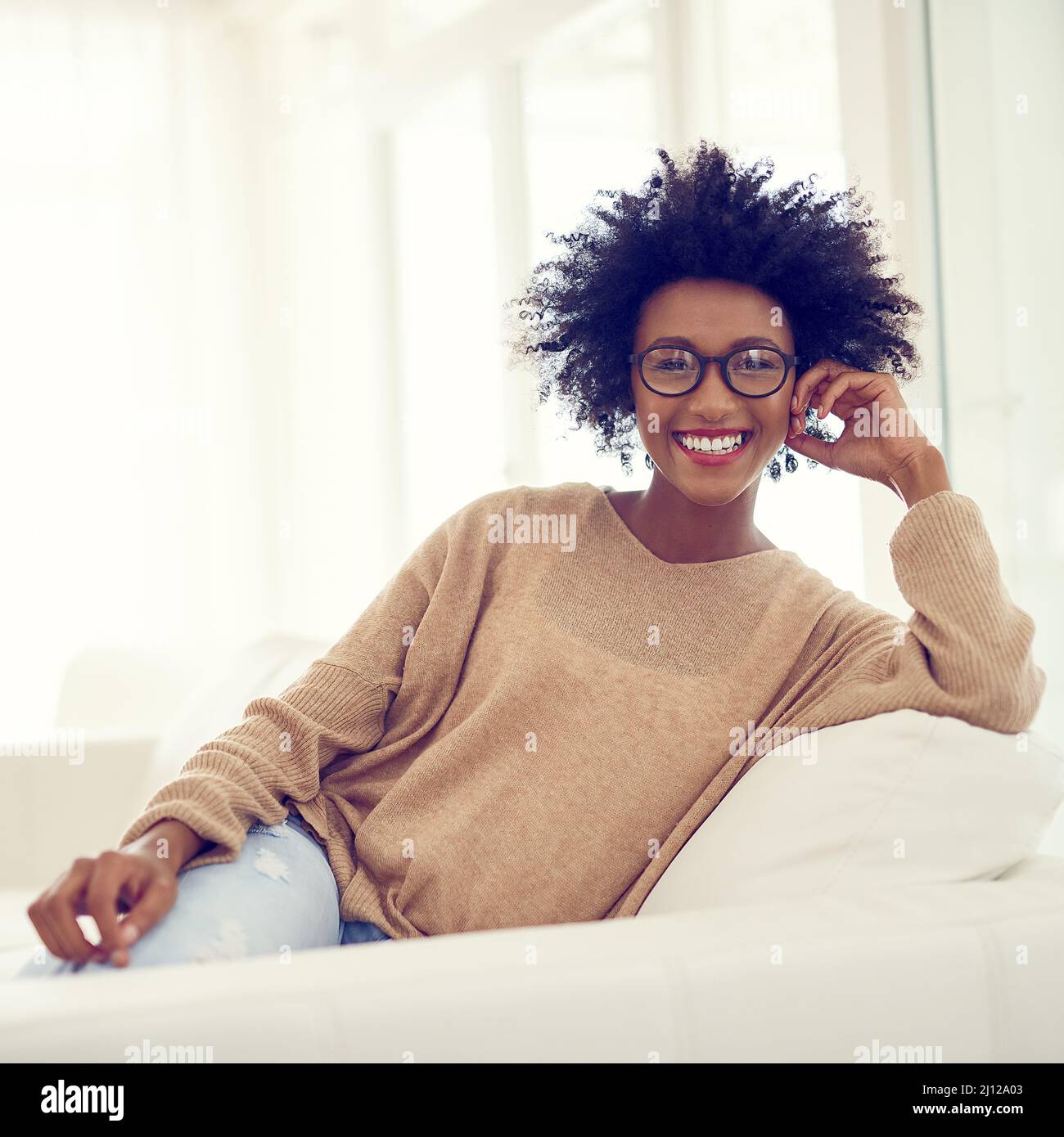 This weekend is all about comfort. Portrait of a happy young woman ...