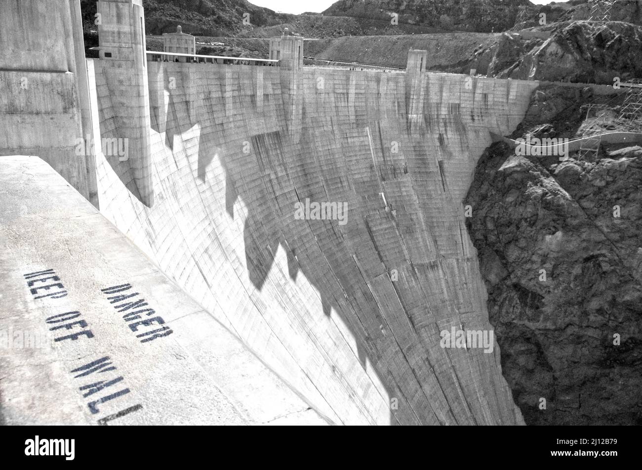 Danger signage at the massive concrete wall of the Hoover Dam, USA ...