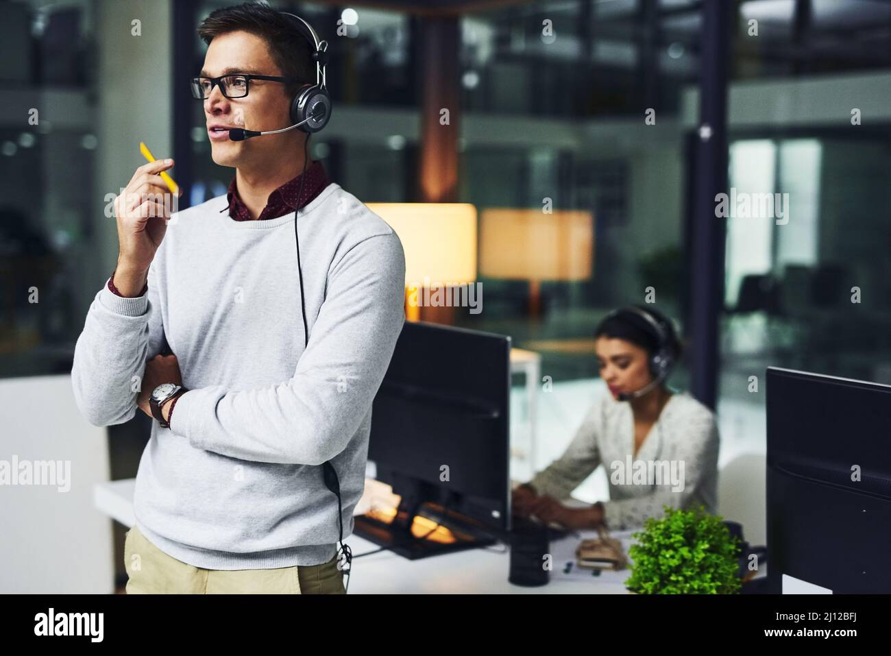 Lets solve your problems one by one.... Shot of a young call centre ...