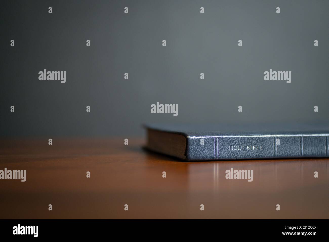 Holy Bible on wood table, with copy space Stock Photo - Alamy