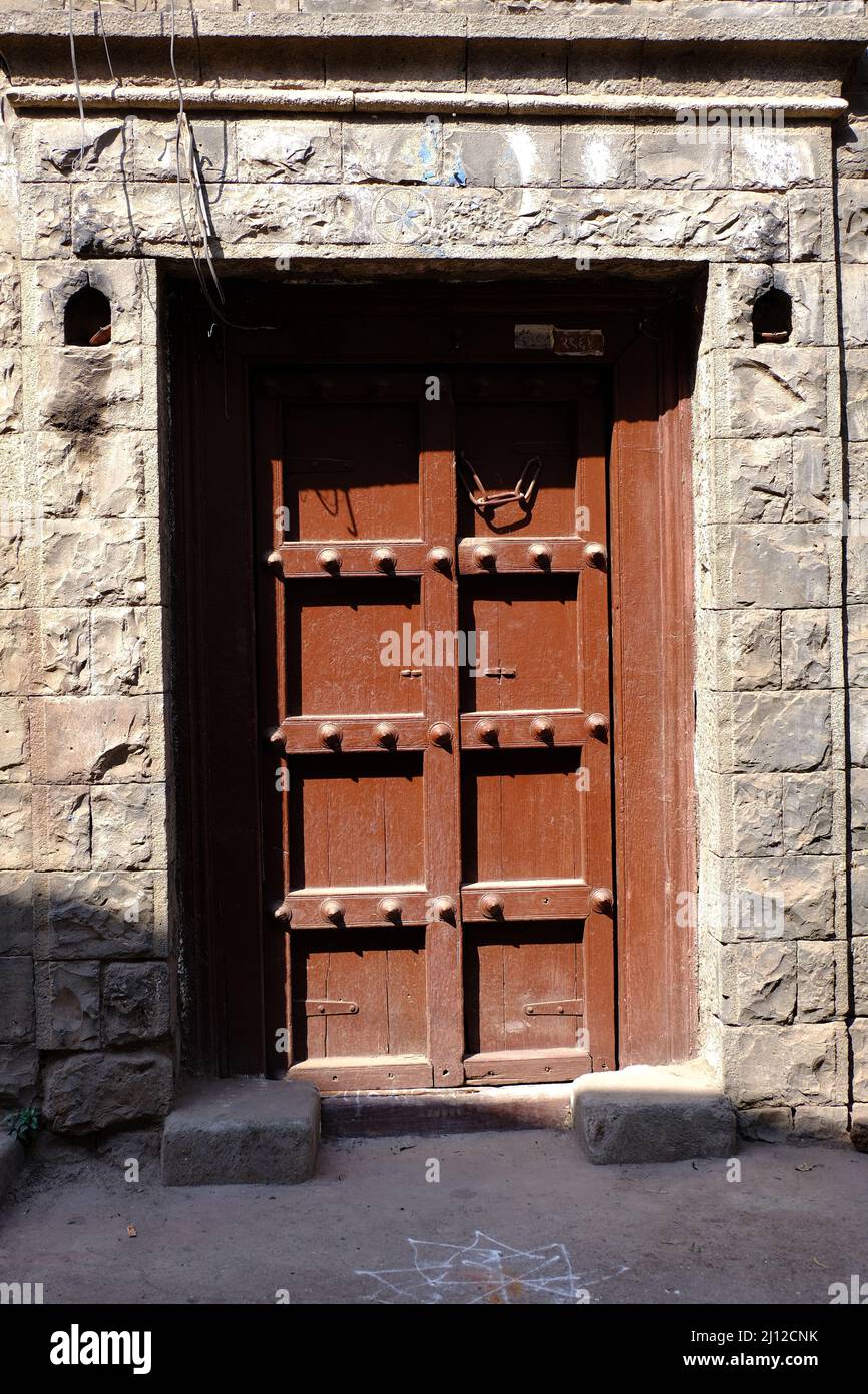 21 March 2022, Pandharpur, India, Old Vintage wooden door on retro wall ...