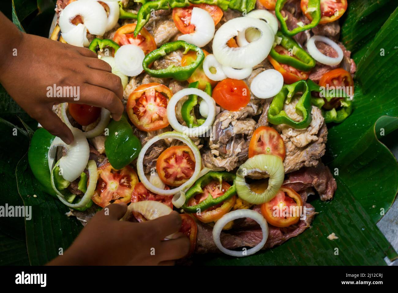 Closeup of the hands of a latin woman preparing the traditional ...