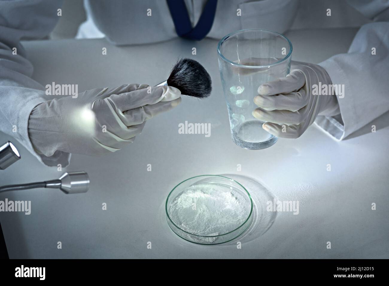 Dusting for prints. High angle shot of an unrecognizable female ...