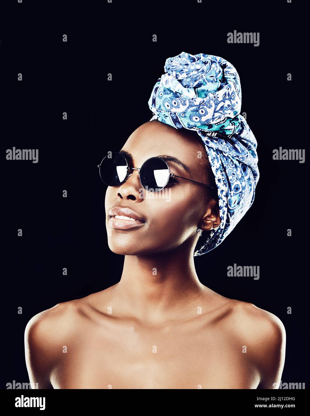 This is how to wear a scarf with style. Studio shot of a beautiful ...