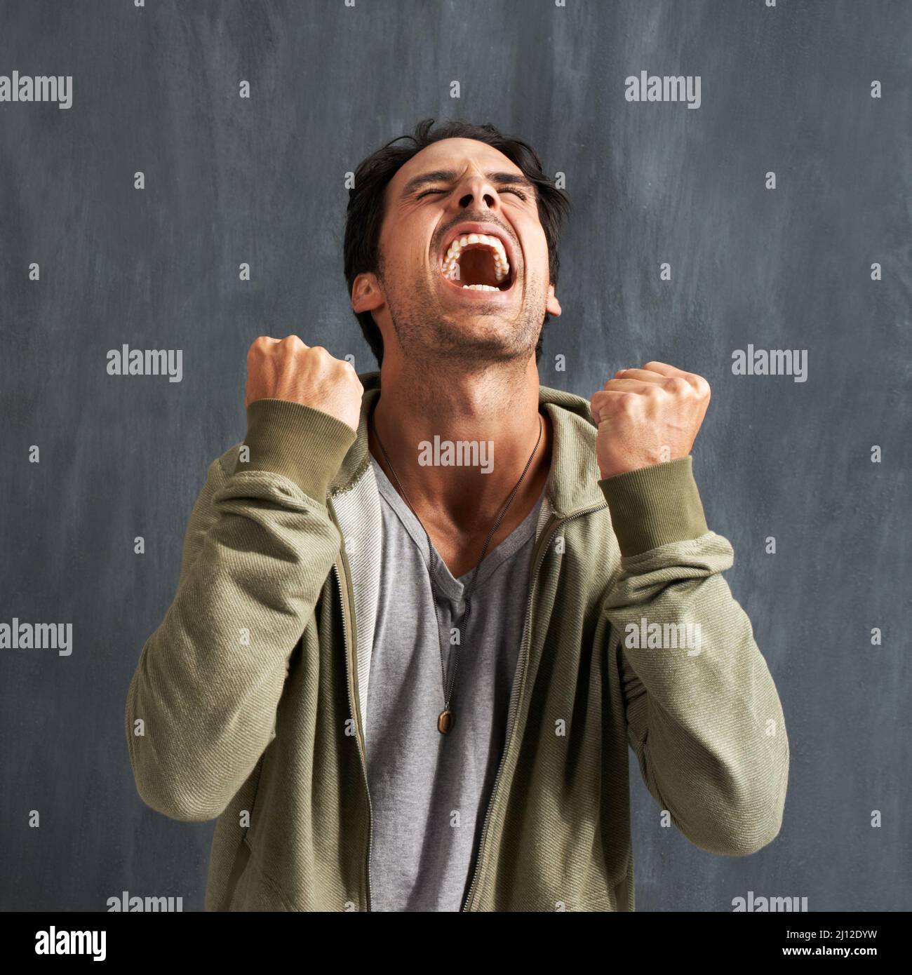 Somethings made him upset. A young man yelling in frustration with his ...