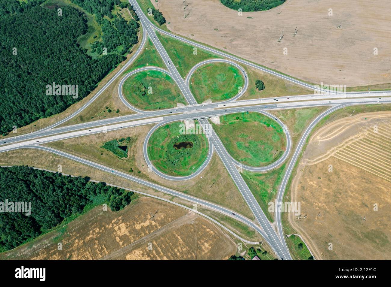 highway road junction. aerial drone view of cloverleaf interchange ...