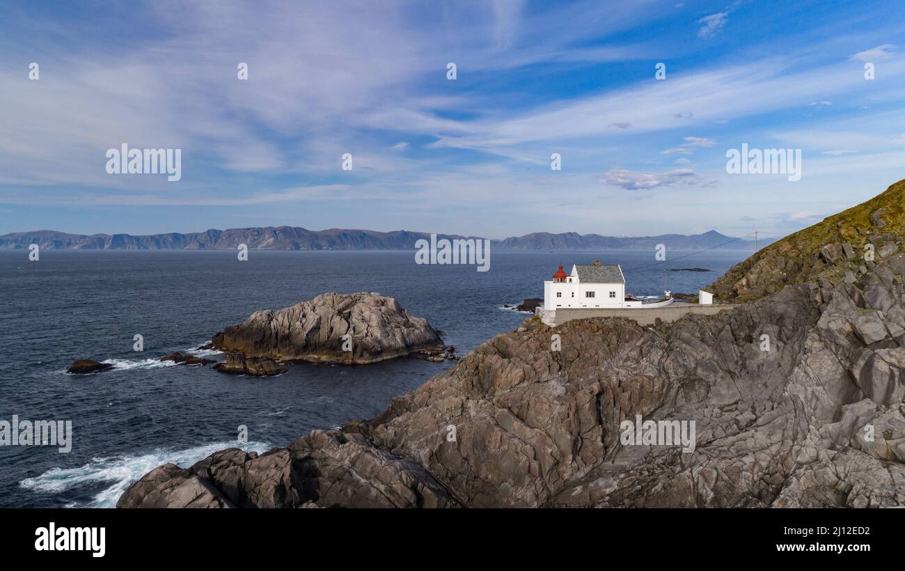Beautiful view of the wavy Norwegian sea gleaming under the cloudy blue ...