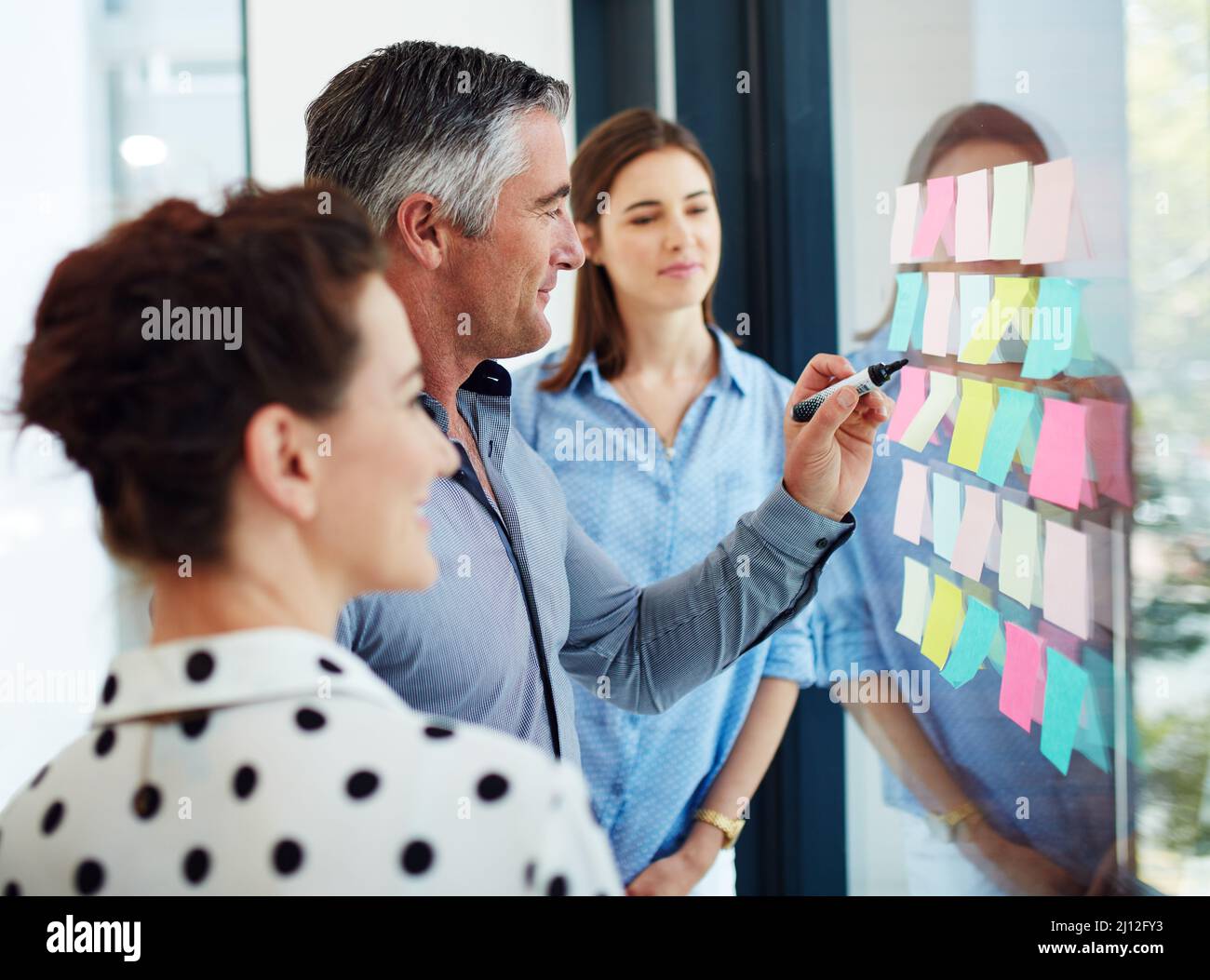 Divide the tasks and multiply success. Cropped shot of three ...