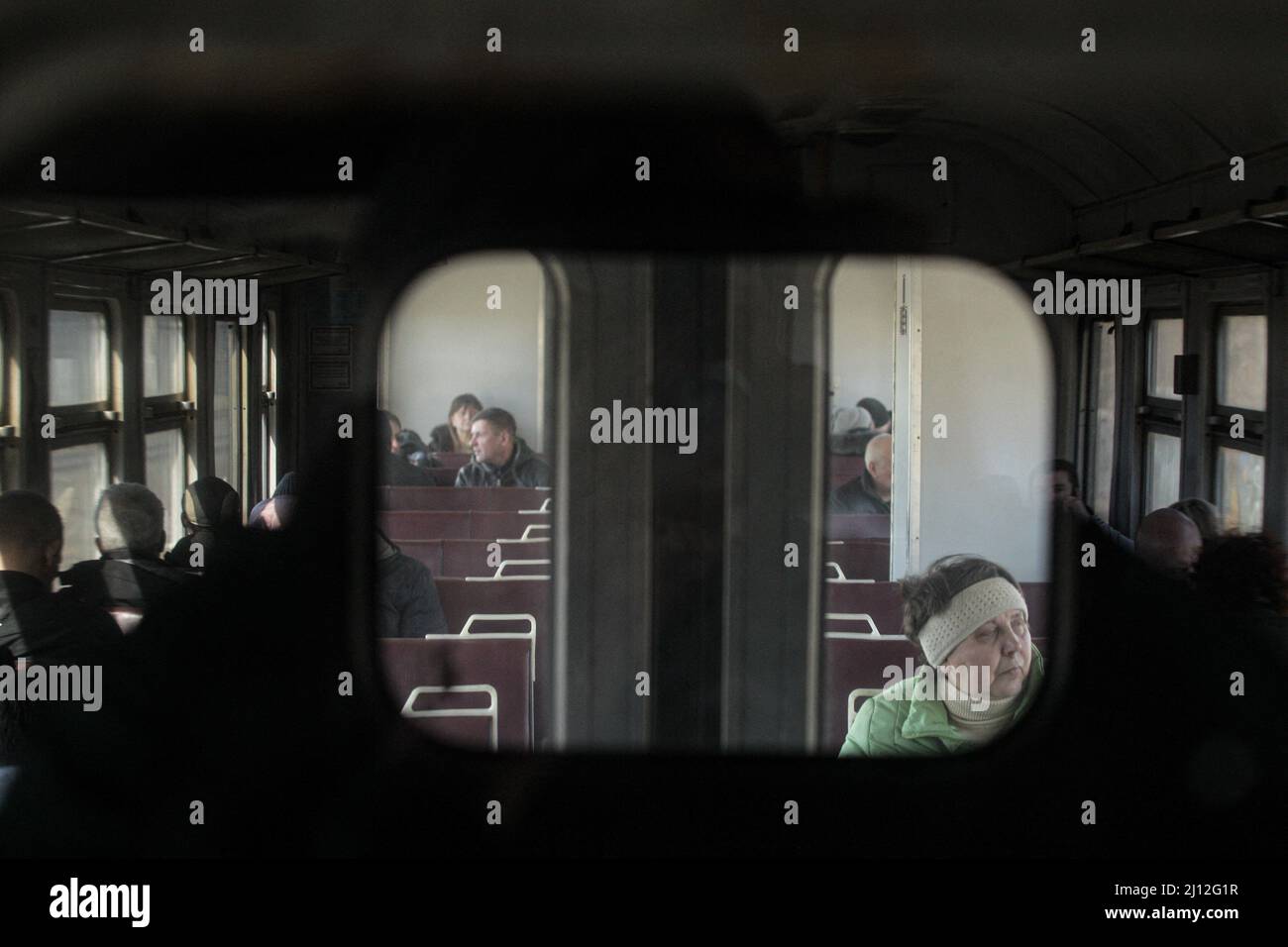 Passengers are seen in the car of the Darnytsia-Sviatoshyn electric ...