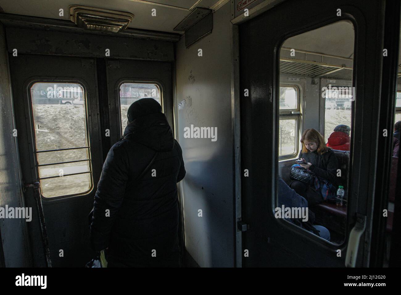 Passengers are seen in the car of the Darnytsia-Sviatoshyn electric ...