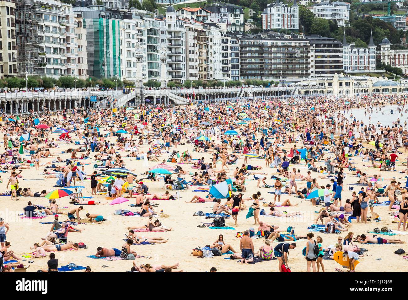 Summer time in San Sebastian crowded La Concha beach Donostia Basque ...