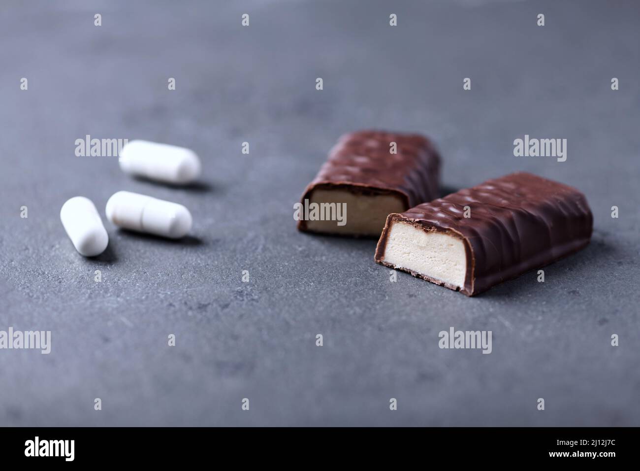 High Protein bar and creatine capsules. Bodybuilding food supplements ...