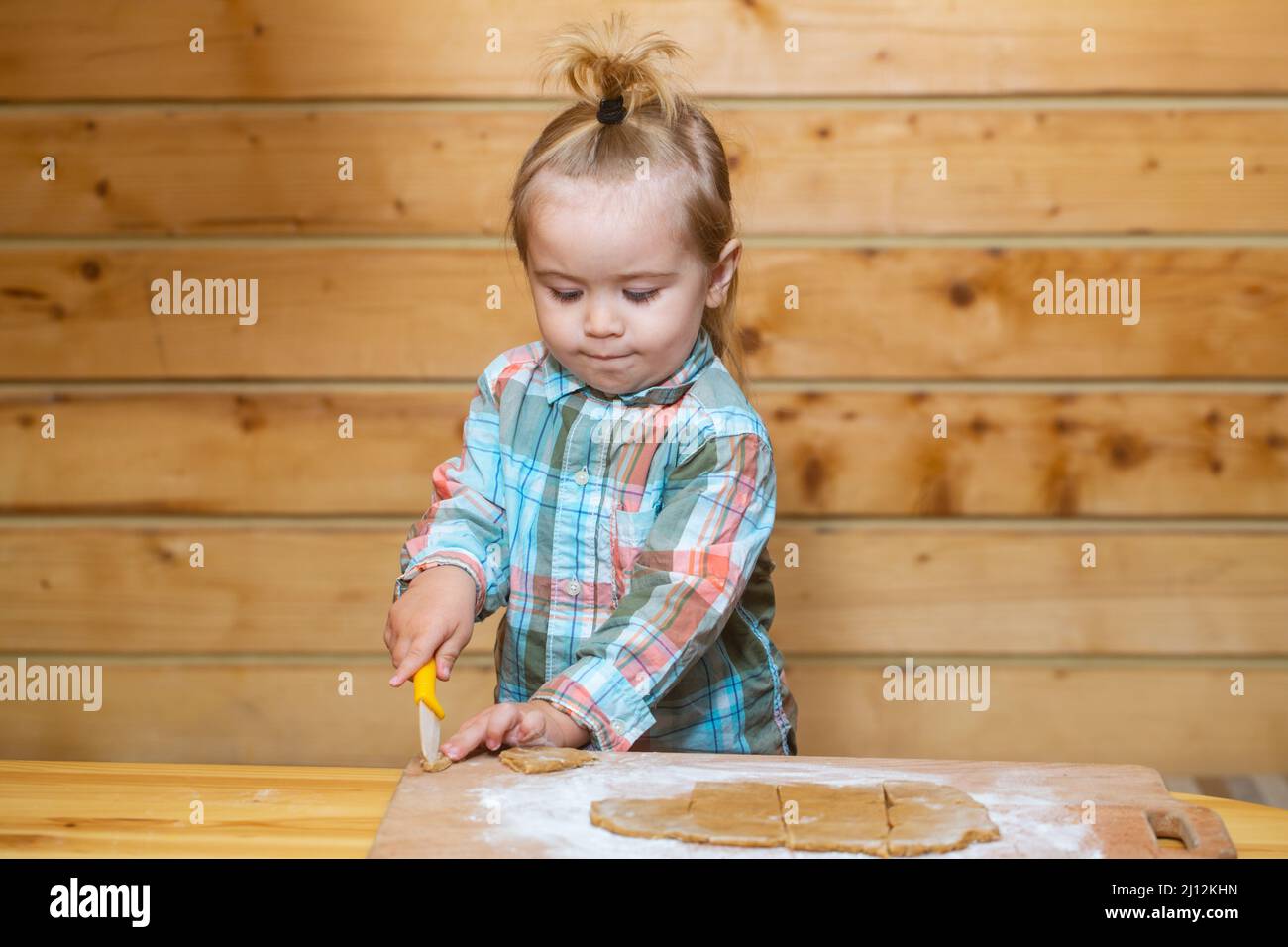 Baby child boy cooking, playing with flour at wooden kitchen Stock ...