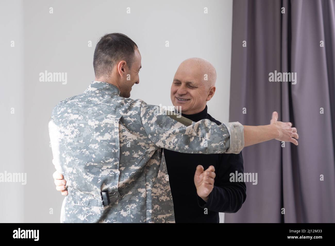 Military father hugs his son when they are reunited after a mission ...