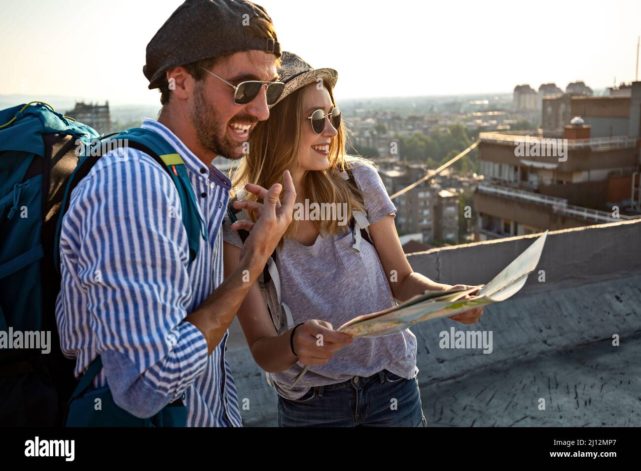 Holiday travel people tourism concept. Smiling couple having fun and ...