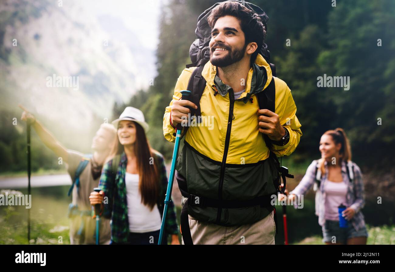 Group of happy hiker friends trekking as part of healthy lifestyle ...